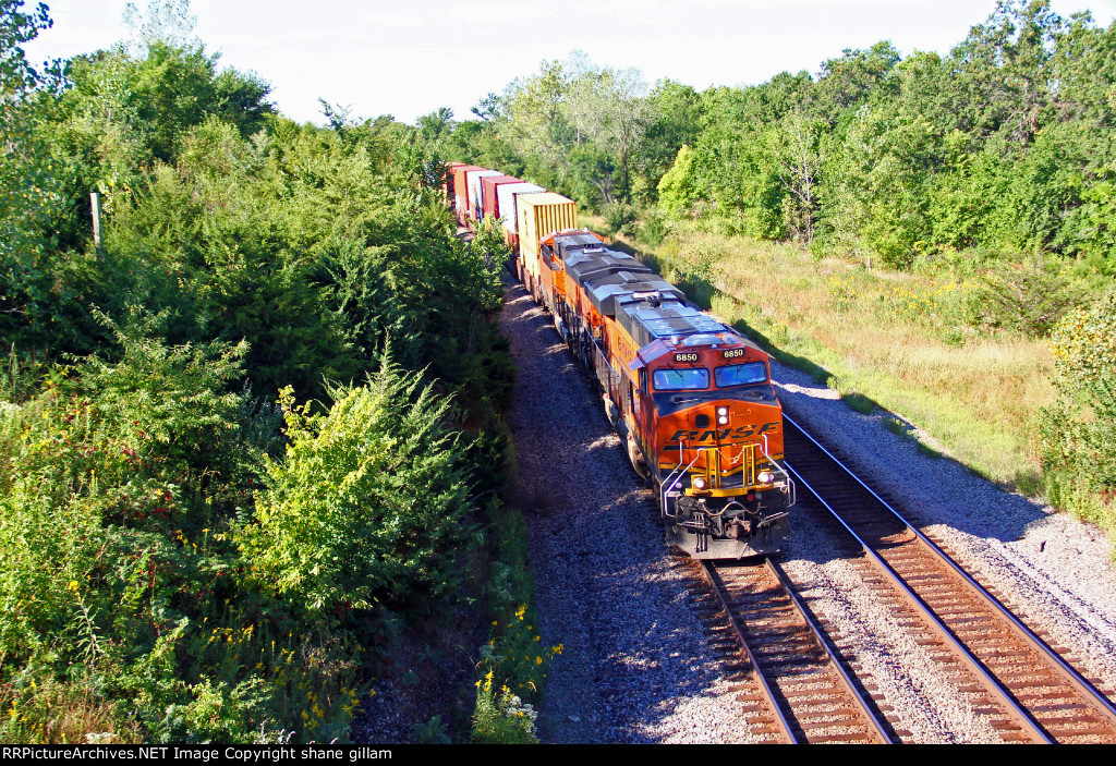 BNSF 6850 Heads up a EB stack train.